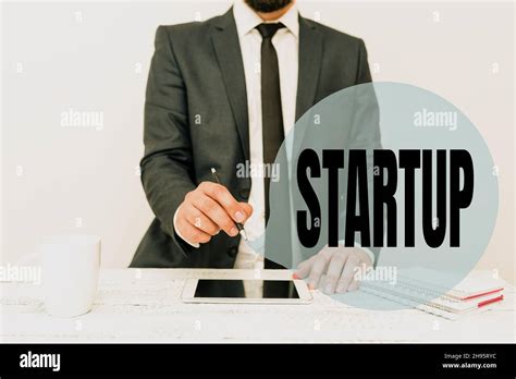 Hand Writing Sign Startup Business Idea The Action Of Setting Something In Motion Newly