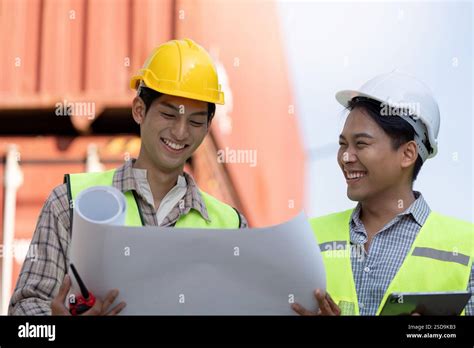Engineers Collaborating On Logistics Plans At Construction Site Urban Environment Technical