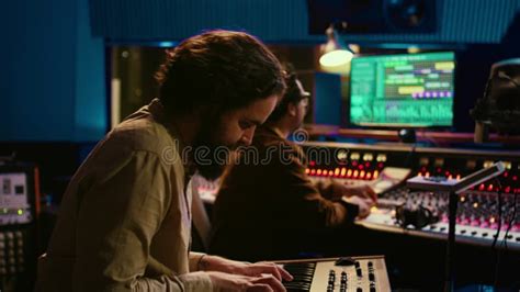 Skilled Performer Musician Recording Tunes On Electronic Keyboard Stock