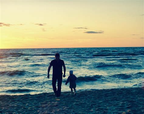 Premium Photo Full Length Of Father With Daughter At Beach Against