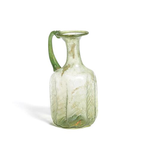 Bonhams A Roman Olive Green Glass Nonagonal Jug