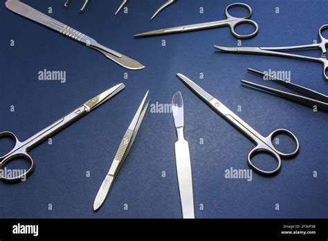 A Top View Of Dissection Kit With Stainless Golden Steel Surgical Instruments For Medical