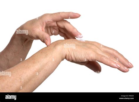 Older Woman Applying Cream On Hands Stock Photo Alamy