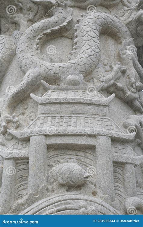 A White Washed Stone Carving Of Ancient China Architecture And An
