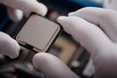 Premium Photo Hands Of Unrecognizable Repairman Holding CPU