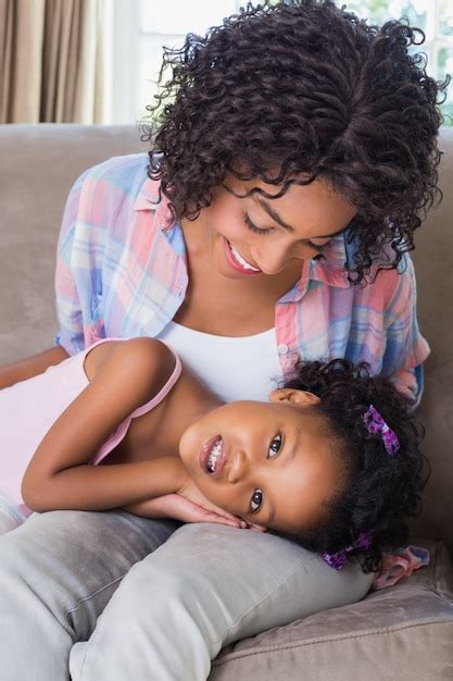 Premium Photo Cute Daughter Lying Across Mothers Lap
