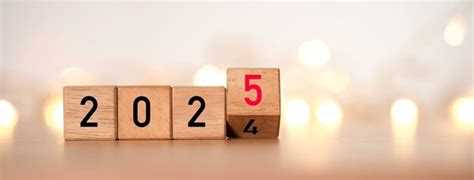 Premium Photo Flipping Of 2024 To 2025 On Wooden Block Cube With