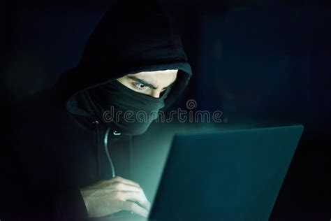 Man Laptop And Hoodie On Black Background For Hacking Phishing And Malware With Virus Hacker
