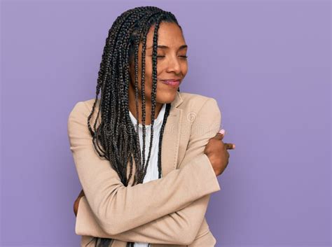 African American Woman Wearing Business Jacket Hugging Oneself Happy