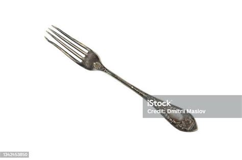 손잡이에 양각 패턴이 있는 오래된 포크의 상단 보기입니다 치아가 구부러져 있습니다 0명에 대한 스톡 사진 및 기타 이미지 0