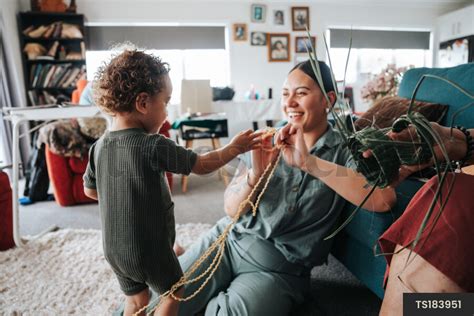 Mother And Son In Lounnge By Ngahuia Ormsby Truestock