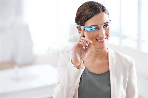 Visions Of The Future Portrait Of A Young Businesswoman Wearing Smart Glasses At Work Stock