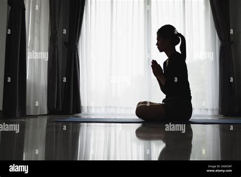 Silhouette Of Woman Prayer Position Praying Hands With Faith In