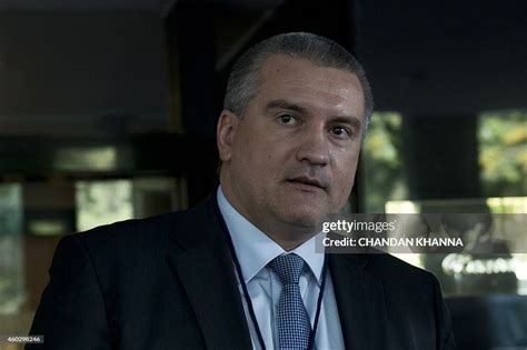 Russian acting leader of Crimea Sergei Aksyonov looks on as he leaves ...