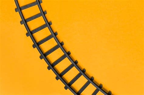 Premium Photo Toy Rails On Yellow