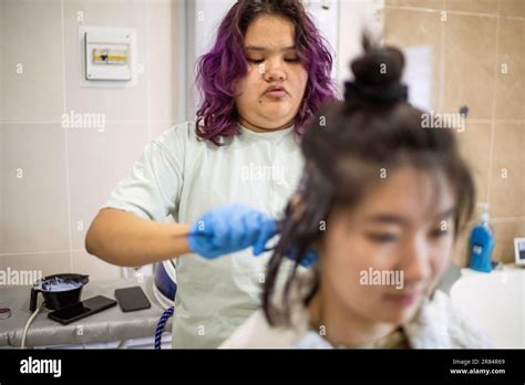 Teens Dye Their Hair White Apply The Dye To Her Hair At Home Stock