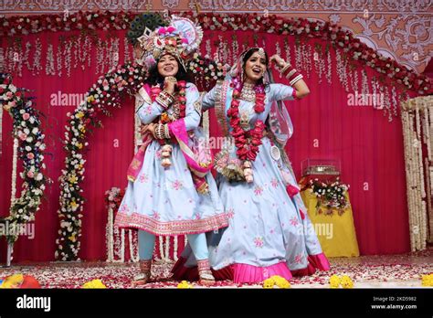 Artists Dressed As Lord Krishna And Goddess Radha Perform During The