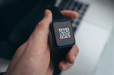 Premium Photo Qr Code Concept Clock With A Symbol On The Screen In The Hands Of The Person