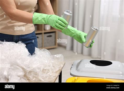 Garbage Sorting Woman Throwing Metal Cans Into Trash Bin In Room Closeup Stock Photo Alamy