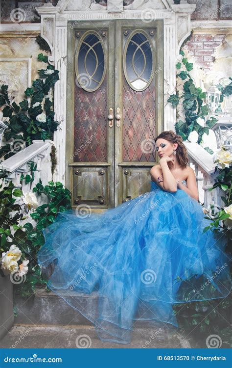 Beautiful Young Woman In Gorgeous Blue Long Dress Like Cinderella With