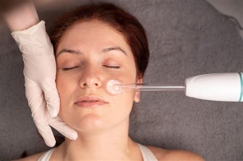 Premium Photo Close Up Of Doctor Examining Patient At Clinic