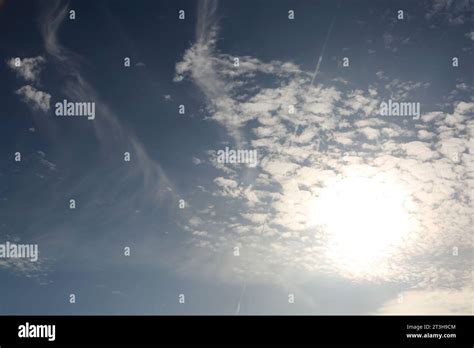 Sun Behind Cirrus And Cirrocumulus Clouds Stock Photo Alamy