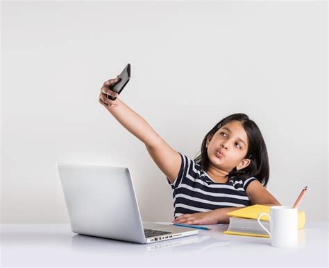 Premium Photo A Young Indian Girl Is Attending Online School Or