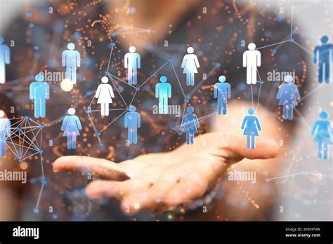 A Group Of 3d Rendered People Icons Hovering Over A Mans Hand Stock