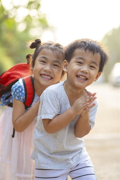 Cheerful Asian Brother And Sister Playing With Happiness Emotion Stock
