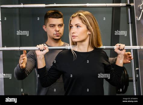 Pretty Attractive Fitness Couple Doing Workout In Gym Healthy