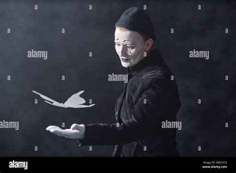 Waist Up Portrait Of Mime Performer Acting On Stage In Spotlight With