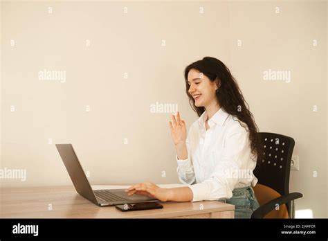 Positive Caucasian Girl Enjoying Friendly Video Call On Laptop Computer