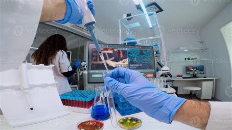 FPV Of Scientist Using Micropipette For Filling Test Tube With Liquid Conducting Chemical