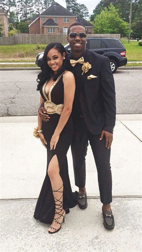 Look How They Shine Together Her In A Black Dress With A High Slit
