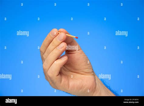 New Unlit Matchstick Held In Hand By Caucasian Male Hand Studio Shot