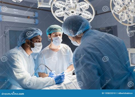 Team Of Surgeons Operating In The Hospital Stock Photo Image Of