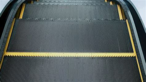 Close Up Of Moving Down Escalator Stairs Calming Rhythm Minimalistic