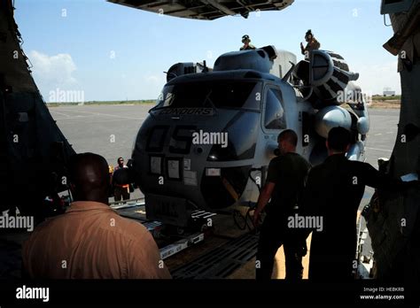 A U S Air Force C 5 Galaxy Crew And Marines Load A Ch 53 Helicopter