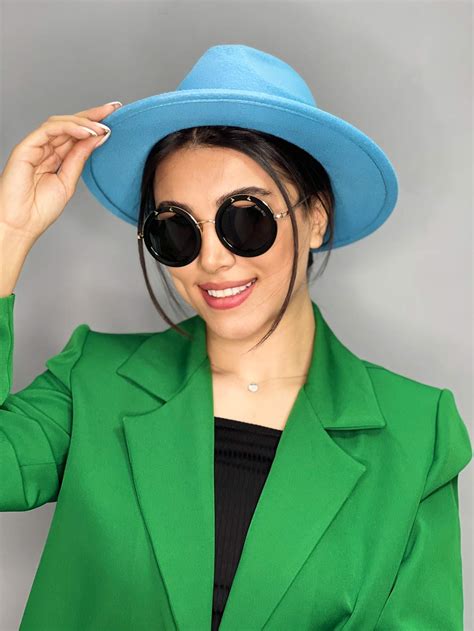 عینک آفتابی زنانه گرد مشکی برند Miu Miu پلاریزه فروشگاه اینترنتی عینک