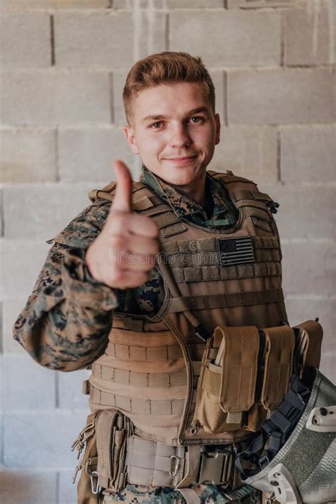 The Soldier Makes A Gesture Of Success With His Hand A Soldier In Full