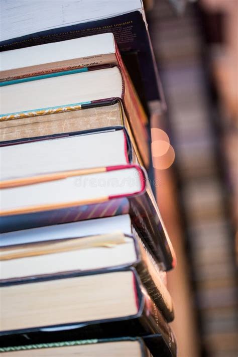 Stack Of Books In Library With Blurry Background Stock Image Image Of