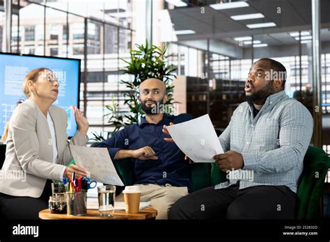 Upset Diverse Team Of Employees Arguing After Making Mistake While Writing Revenue Figures On