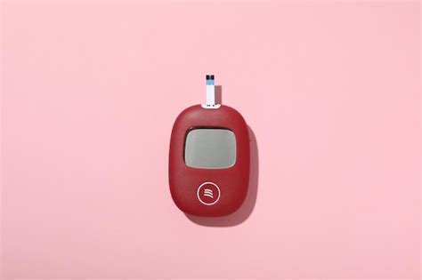 Premium Photo Red Glucometer On Pink Background Top View