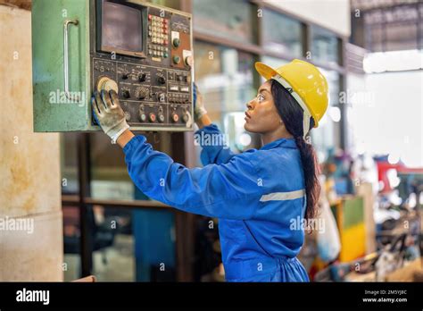 Mechanical Woman In Uniform Working In Machinery Shop Trouble Shooting