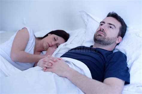 Sad And Depressed Man Lying In The Bed With Wife Stock Image Image Of Family Male