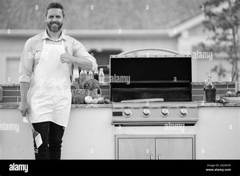 Man Grilling Salmon Fillet For Barbecue Thumb Up Man Grilling Salmon