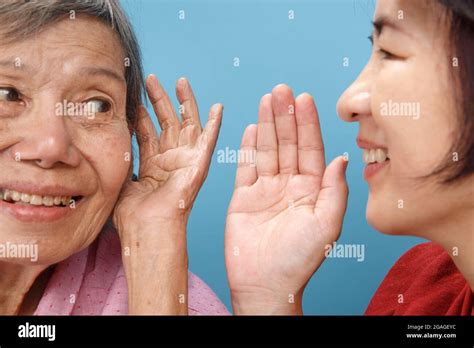 Asian Seniors Woman Hearing Loss Hard Of Hearing Try To Talk With Babe Stock Photo Alamy