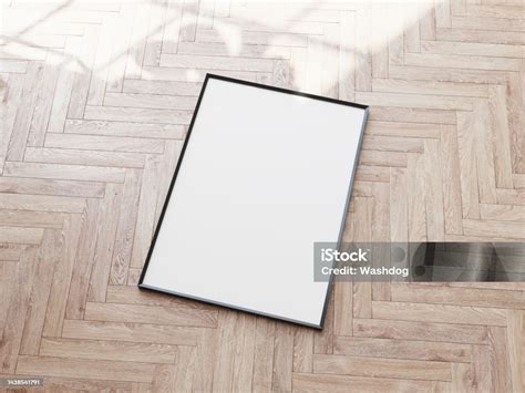 얇은 검은색 테두리가 나무 쪽모이 세공 마루 바닥에 누워 있는 빈 흰색 직사각형 액자 3d 그림입니다 0명에 대한 스톡 사진 및