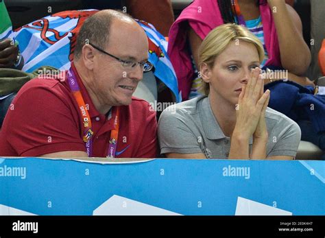 Prince Albert Ii Of Monaco And Princess Charlene Of Monaco Following