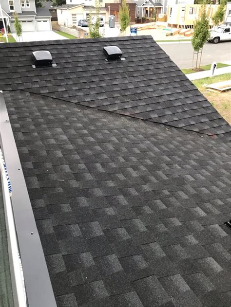 What Prevents Water From Getting Underneath These Roof Shingles Home